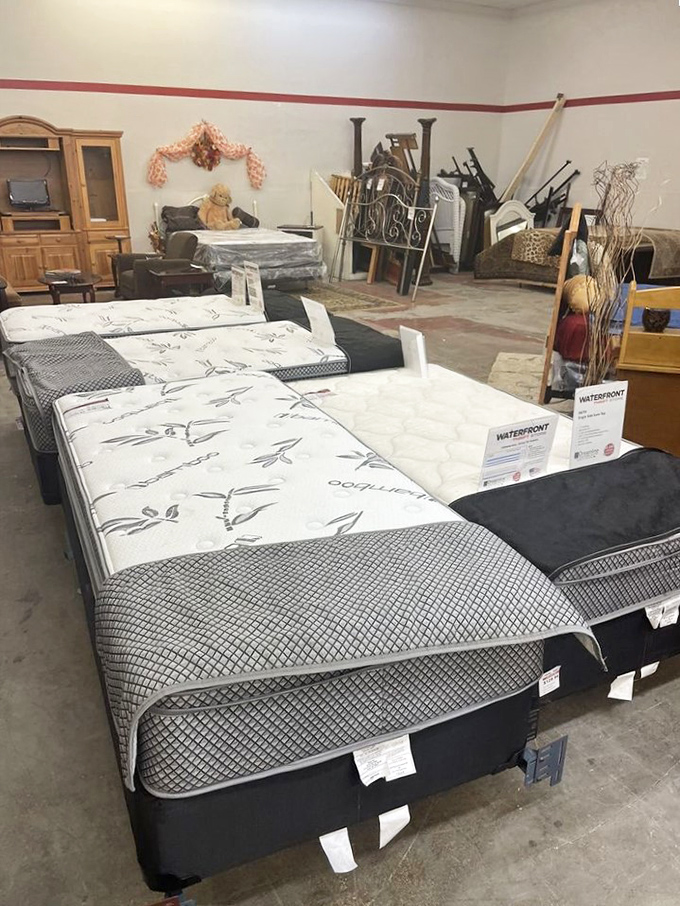 Mattresses lined up like dominoes, each promising better sleep than your current financial stress allows.