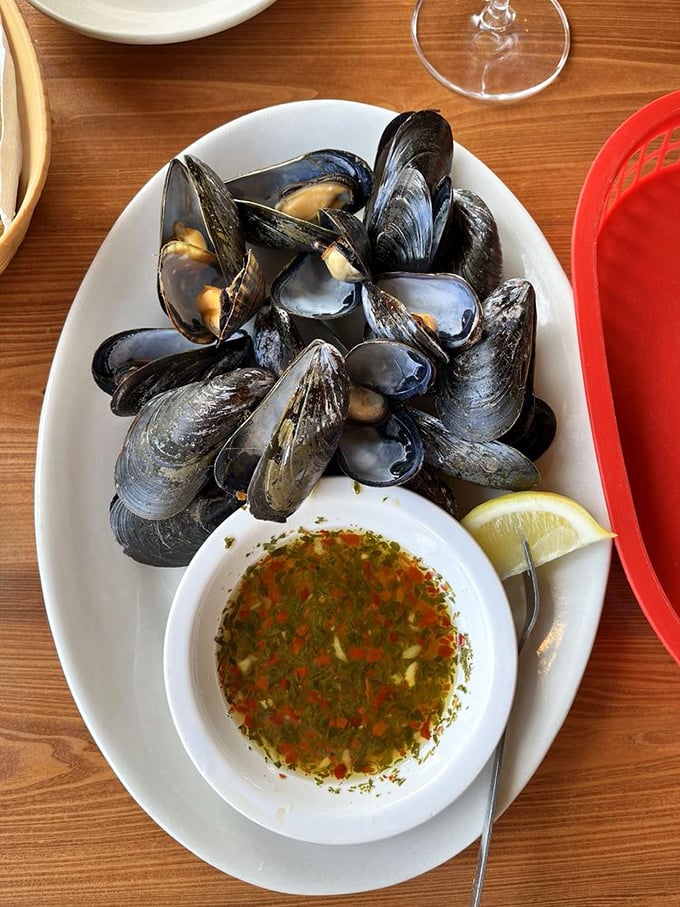 These mussels aren't just showing off their muscles &ndash; they're ready to dive into that herb-infused broth with a squeeze of lemon.