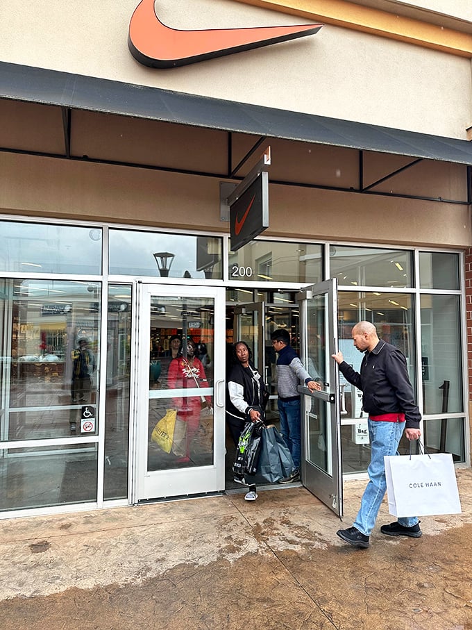 The Nike Factory Store entrance welcomes shoppers with the promise that retail therapy and actual therapy can indeed be the same thing&mdash;just do it!