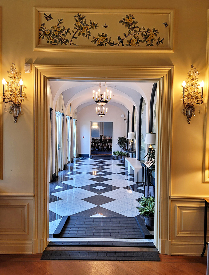 This hallway's black and white floor practically demands you practice your ballroom dancing skills while pretending you've been invited to a Gatsby-level soir&eacute;e.