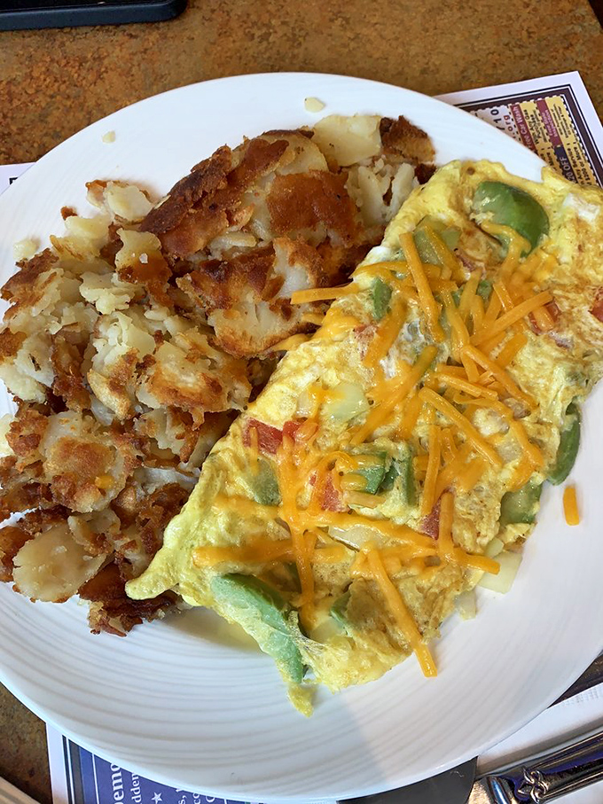 An omelet that perfectly demonstrates the art of the fold, with home fries so perfectly crisped they deserve their own fan club.