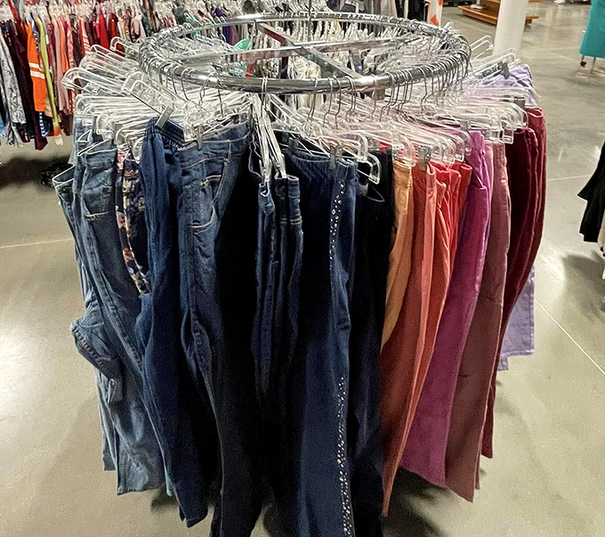 The circular rack of jeans and colorful pants creates a textile color wheel, from denim blues to sunset oranges&mdash;fashion's second chance at making first impressions.