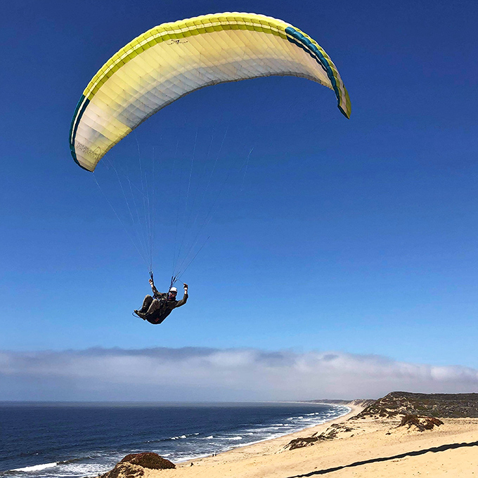 Who needs expensive theme parks when you can soar like a seagull? Paragliders catch perfect thermals above dunes that dwarf most roller coasters.