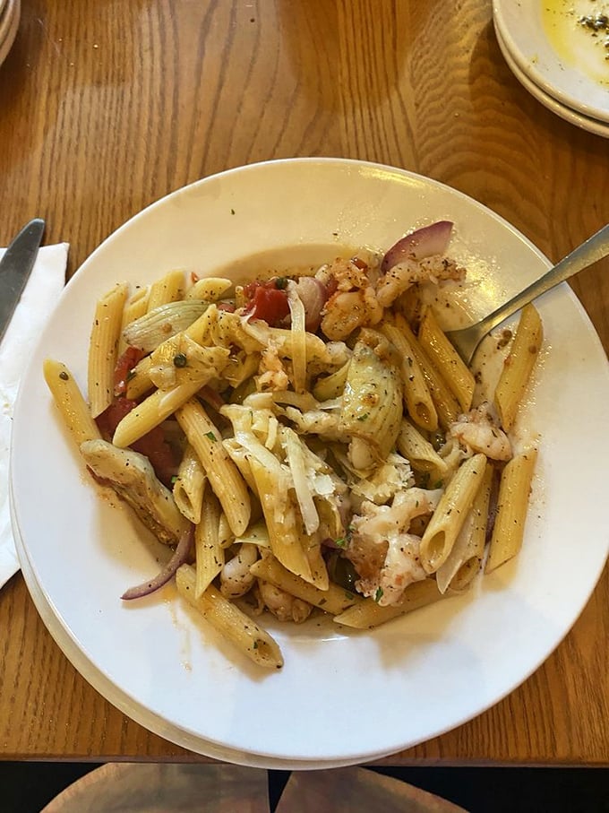 Pasta that doesn't just sit on the plate but tells a story—each strand coated in sauce that clearly took someone's grandmother years to perfect.
