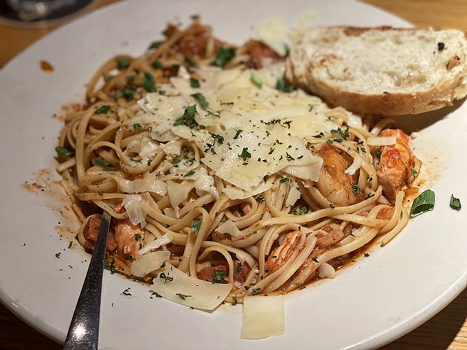 House-made pasta twirled with bacon creates comfort food that transcends ordinary weeknight dinner expectations completely.