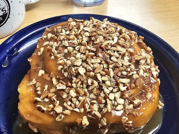 That sticky bun glistening with pecans and glaze represents everything right about breakfast dessert becoming an actual thing.