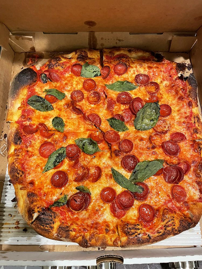 Pepperoni that curls into little flavor cups, creating pools of spicy oil that transform this pizza into something transcendent.