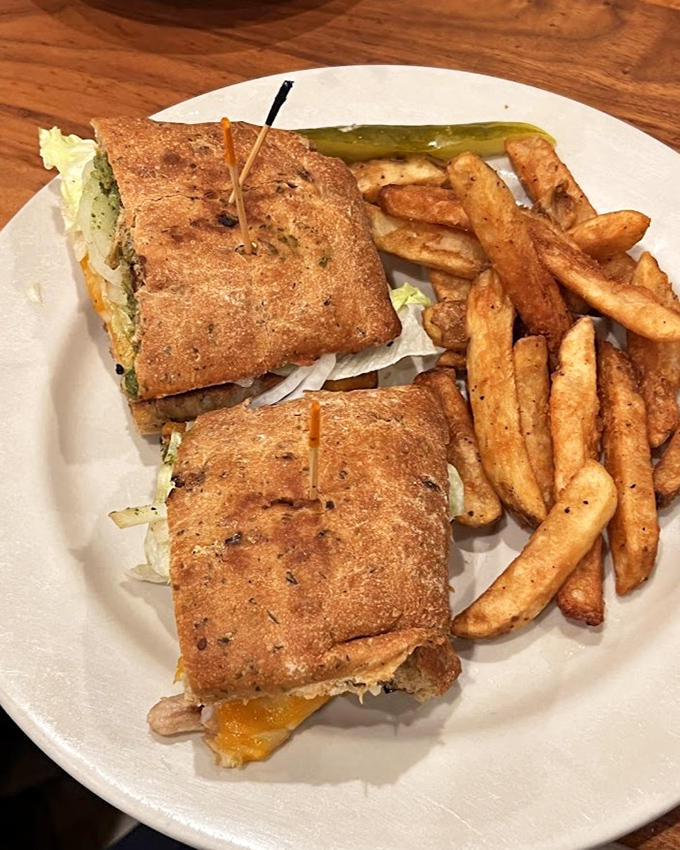 This sandwich doesn't just satisfy hunger&mdash;it creates happiness. Crispy bread, melty cheese, and that pickle spear standing guard like a delicious sentinel.