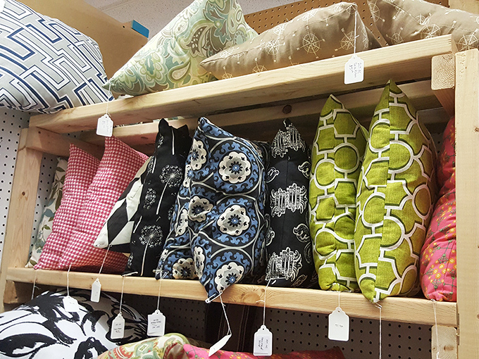 Pillows with personality waiting for the right couch to call home. That geometric green pattern screams "I watched The Brady Bunch when it first aired."