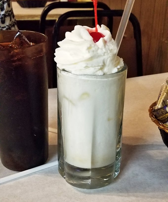 A vacation in a glass! This pi&ntilde;a colada topped with whipped cream and a cherry brings tropical vibes to Pennsylvania, no passport required.
