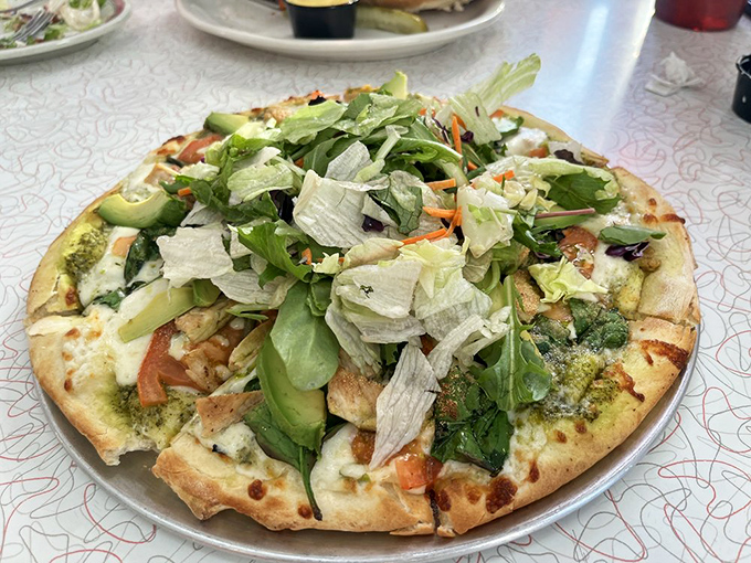 This isn't just pizza&mdash;it's a garden party on a crust, where fresh greens meet melted cheese in a combination that somehow works brilliantly.