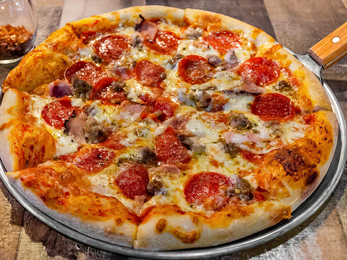 Pizza that doesn't try to be Italian &ndash; it's proudly American, with a generous blanket of cheese and pepperoni that curls at the edges just right.