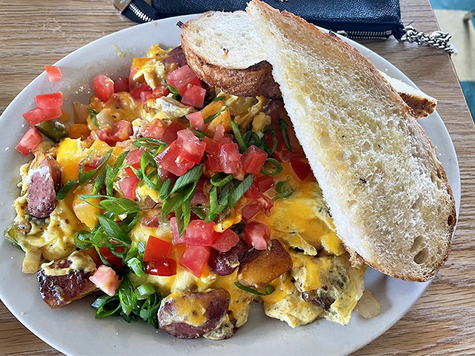 A scramble that tells a story. Every bite offers a different chapter of flavors, with that crusty bread standing by for the epilogue.