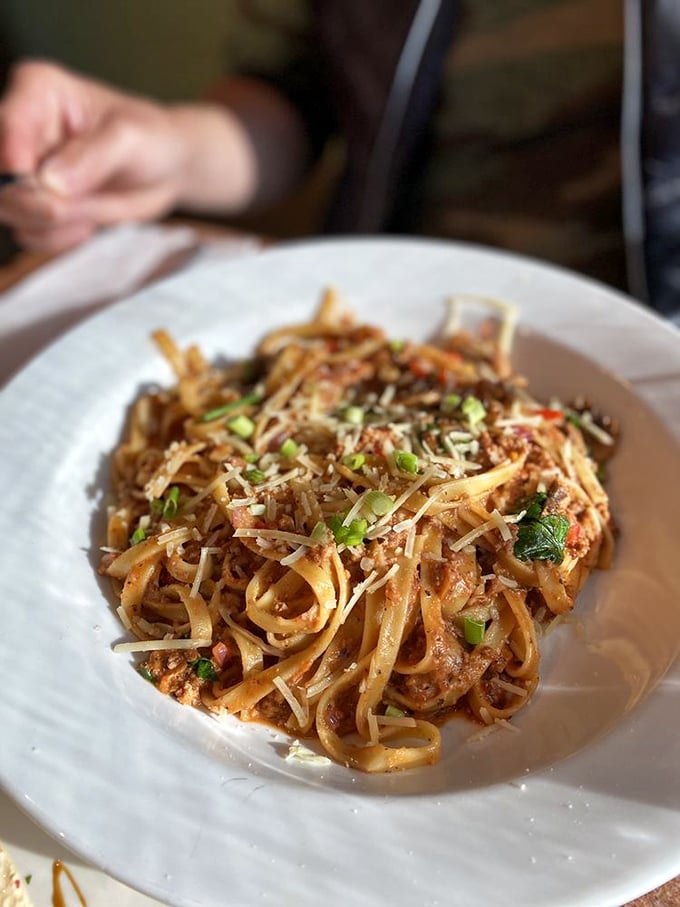 Pasta that doesn't just sit on the plate&mdash;it performs. This pork bolognese has more layers of flavor than Alaska has layers of winter clothing.