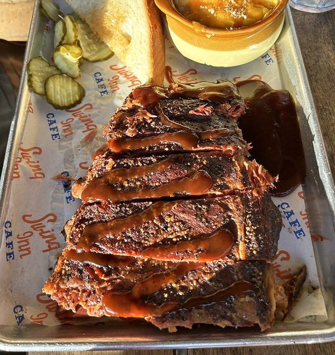 Ribs with that perfect bark and pink smoke ring&mdash;the kind that make vegetarians temporarily question their life choices.