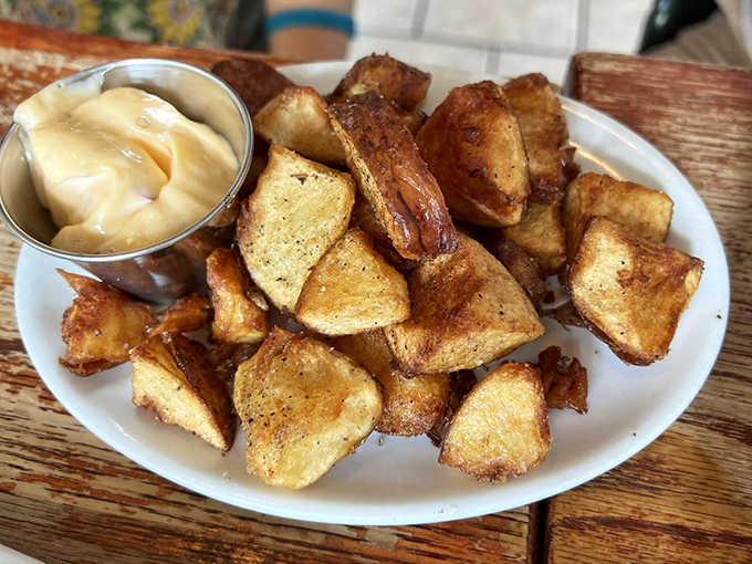 Golden-brown potatoes with a side of aioli &ndash; proof that sometimes the simplest side dishes are the ones we remember most fondly.