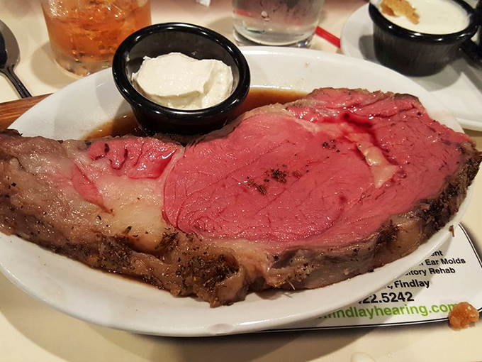 Prime rib so perfectly cooked it makes you wonder if the chef has some sort of meat telepathy. That rosy center is speaking a language of deliciousness.