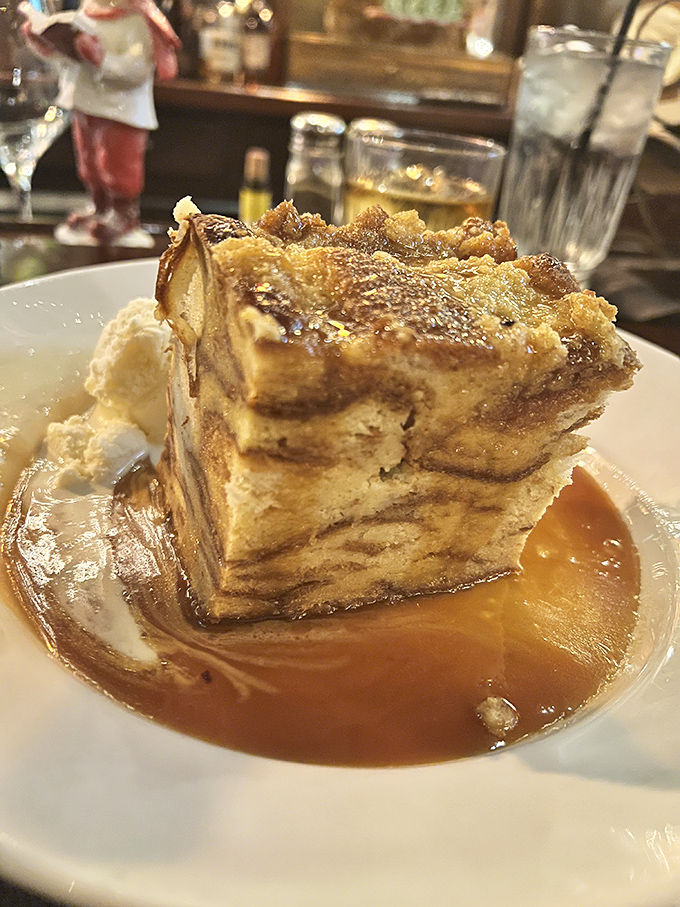 This isn't just bread pudding&mdash;it's an architectural marvel of custard-soaked layers bathed in caramel sauce that would make your grandmother both jealous and proud.