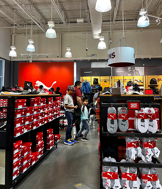 The Puma store's bold red walls and endless shoe options make even non-athletes contemplate their sudden need for performance footwear.
