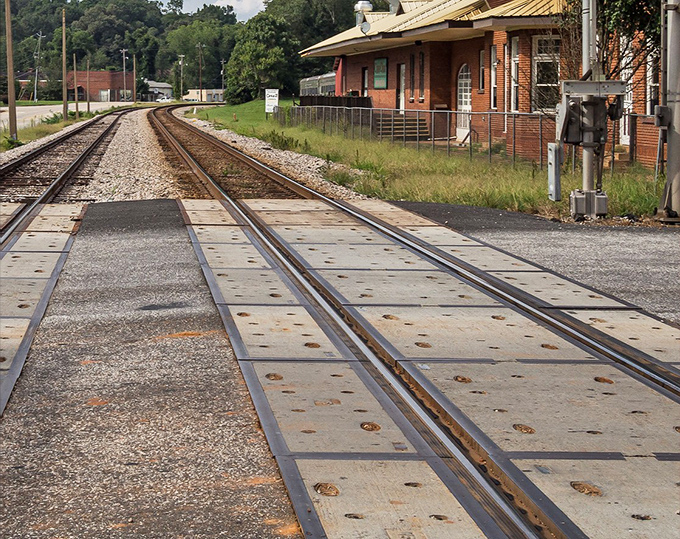 Railroad tracks stretching toward possibility. In Hogansville, the train crossing isn't just infrastructure&mdash;it's a reminder of connections to everywhere else.
