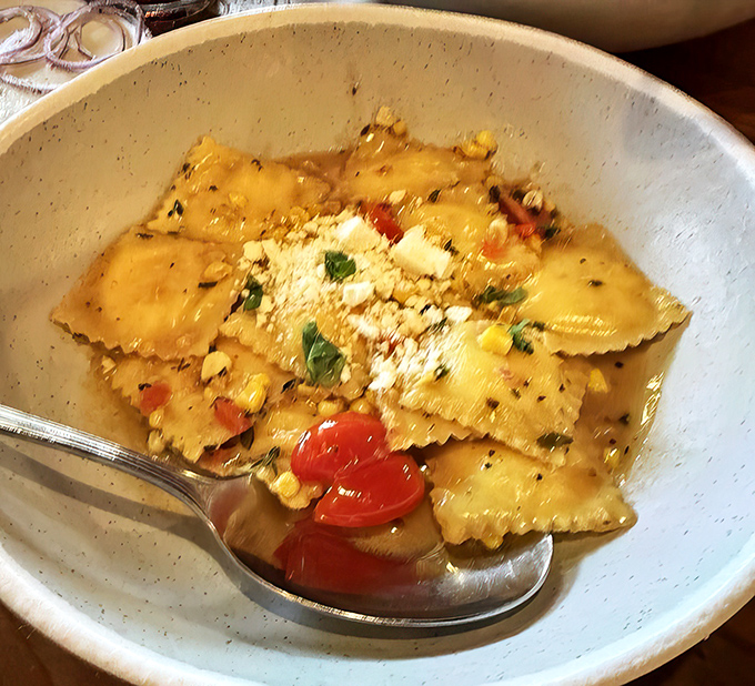 Ravioli that would make your Italian grandmother weep with joy. Tender pasta pillows surrounded by a buttery sauce and sweet cherry tomatoes.