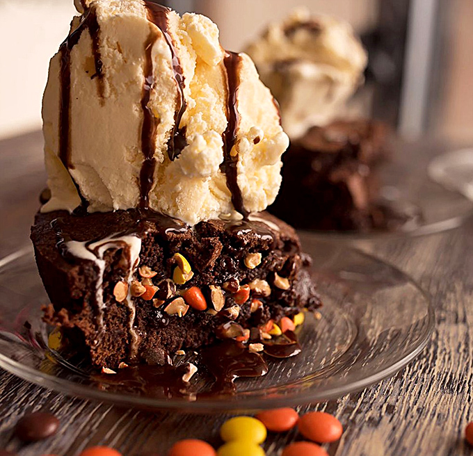 Ice cream melts into warm brownie like a sweet avalanche, proving that dessert perfection sometimes requires a bit of chaos.