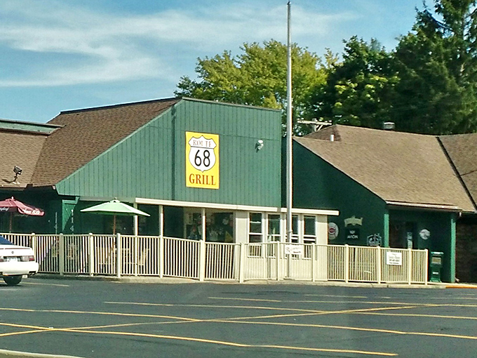 Green metal siding and white railings mark a local spot where comfort food comes without pretension or corporate formulas.