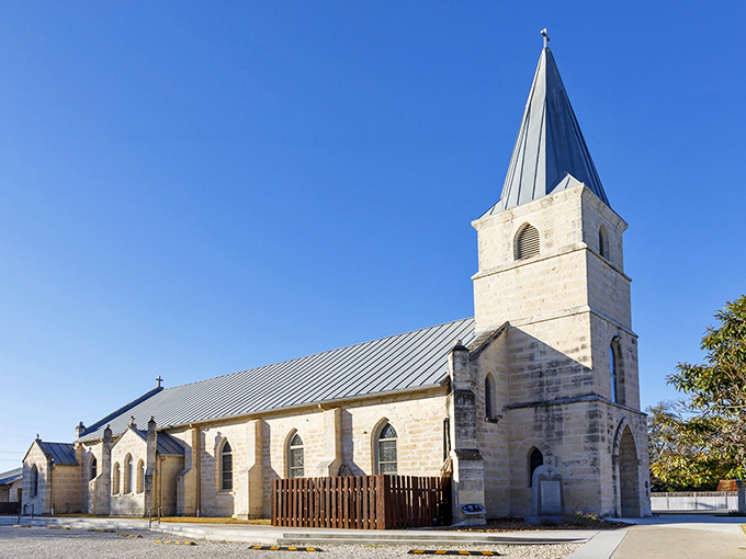 St. Stanislaus Catholic Church's limestone walls have witnessed generations of prayers, weddings, and the occasional cowboy hat respectfully removed at the door.