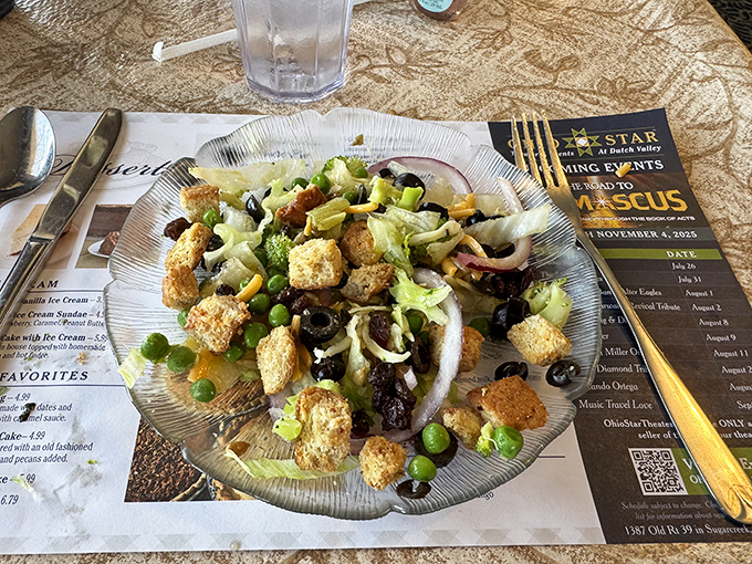 Even the salad looks substantial here, proving vegetables can pull their weight when properly motivated by cheese.