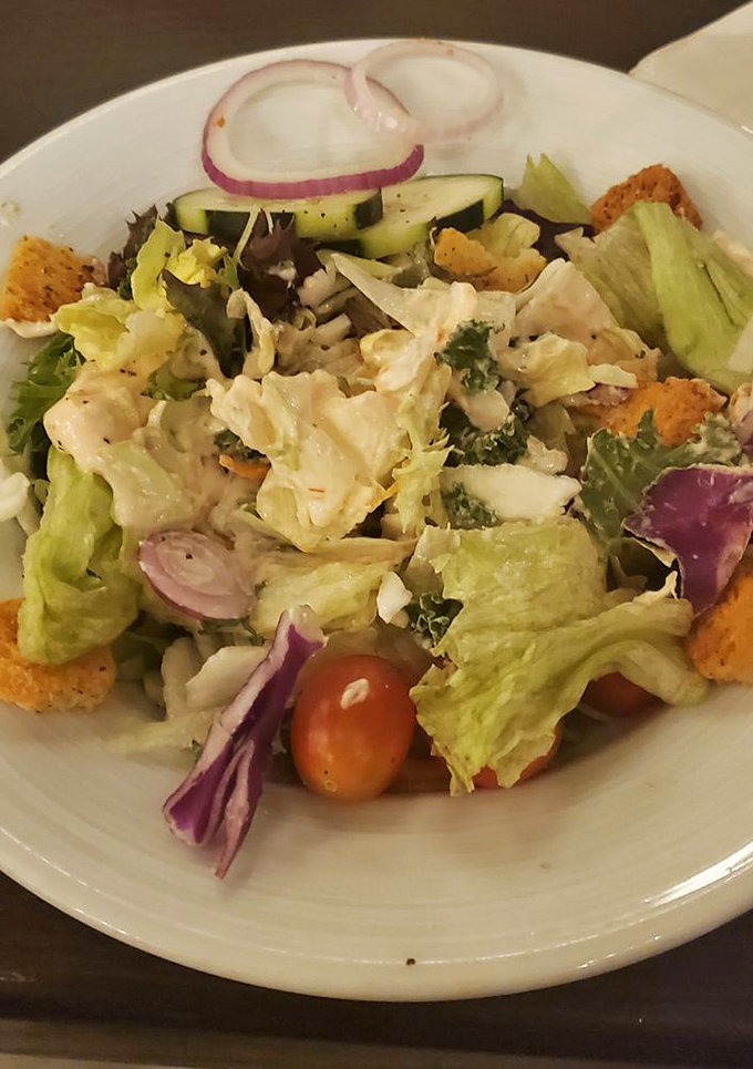 A house salad that refuses to be an afterthought – fresh, colorful, and substantial enough to make vegetarians feel respected.