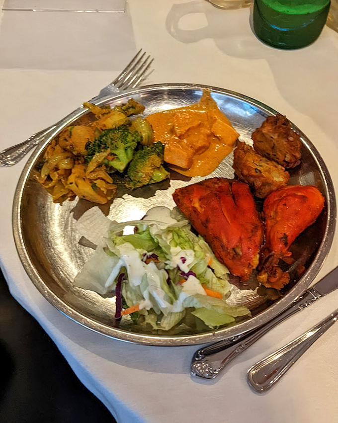 A plate that tells the whole story&mdash;vibrant tandoori chicken, fresh salad, and perfectly cooked rice creating a harmonious trilogy of taste.