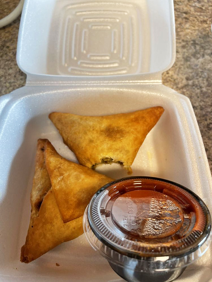 Crispy sambusas: where Ethiopian spices meet flaky pastry in a hand-held package that makes egg rolls jealous.