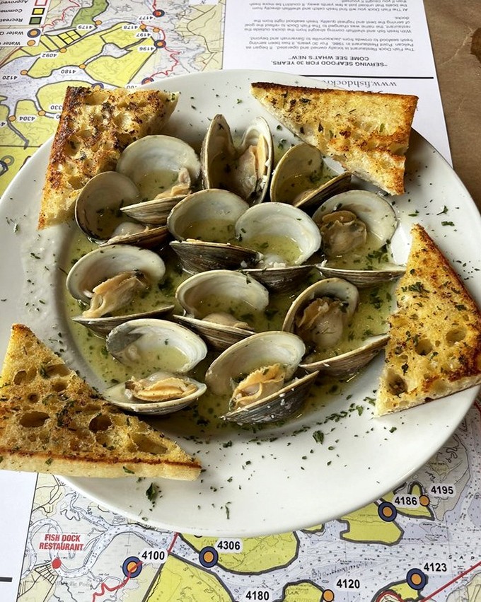 Sapelo clams swimming in buttery bliss. These local treasures and garlic toast triangles are perfect for sopping up every last drop.