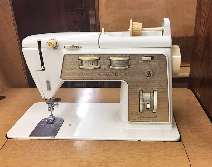 A vintage Singer sewing machine stands as a monument to craftsmanship from an era before "planned obsolescence" was a business strategy.