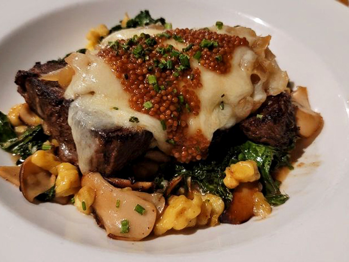 This short rib doesn't just fall off the bone &ndash; it practically leaps onto your fork, crowned with melted cheese and mustard seeds.