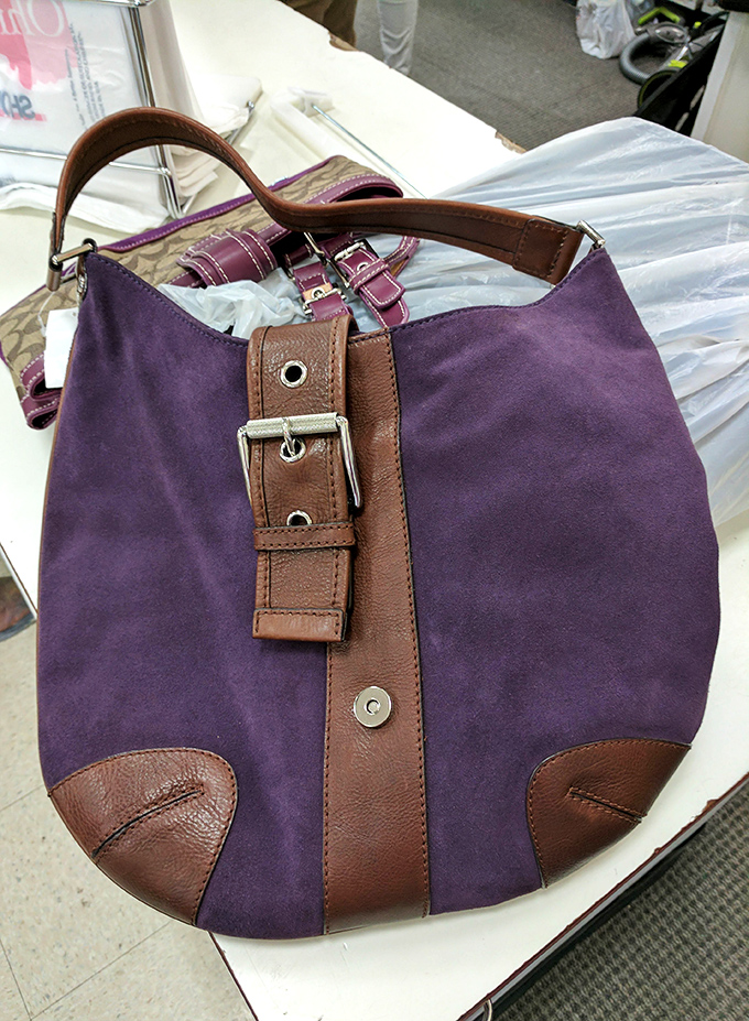 This purple suede and leather handbag isn't just an accessory&mdash;it's someone's future conversation starter and memory maker.