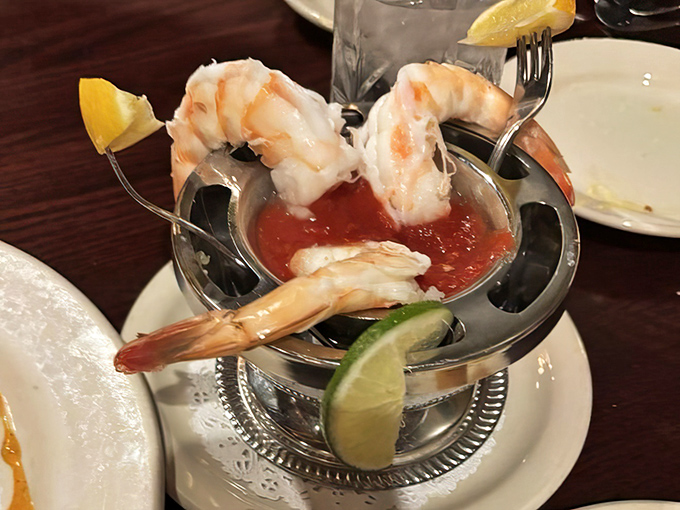Shrimp cocktail served with old-school elegance. These plump crustaceans perched on the edge of their silver throne are ready for their close-up.