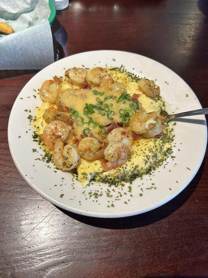 Shrimp and grits elevated to art form&mdash;plump crustaceans lounging on a bed of cheesy comfort.
