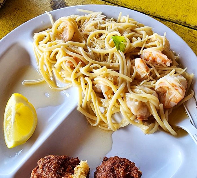 Shrimp scampi that proves pasta is just a vehicle for delivering more seafood to your face. That lemon wedge isn't optional.