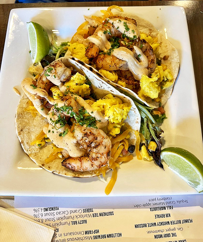 These shrimp tacos aren't just a meal, they're a vacation on a plate. The lime wedges are standing by, ready for duty.