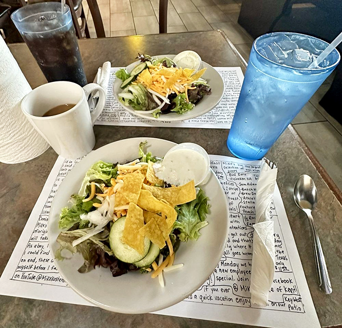 Even the side salads get the royal treatment, served on placemats covered with enough text to keep you entertained through three courses.