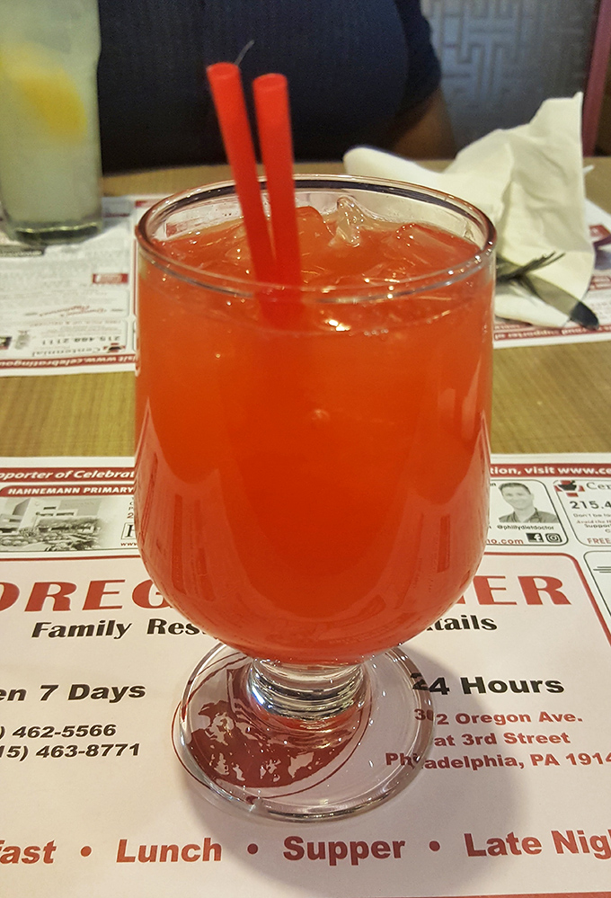 The Singapore Sling cocktail brings a splash of color to the diner experience&mdash;breakfast can wait.