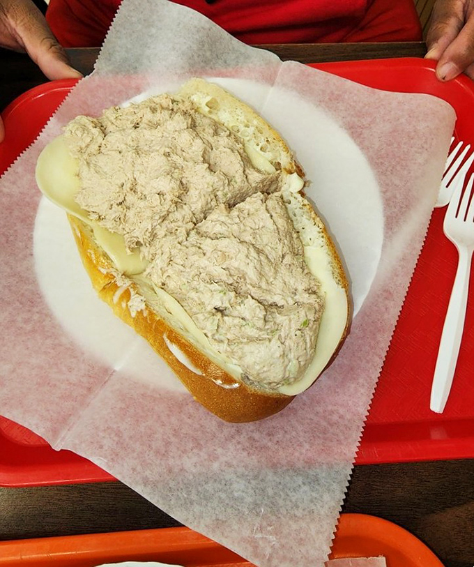 Tuna salad elevated to art form. This isn't your sad desk lunch – it's the sandwich equivalent of winning the lottery.