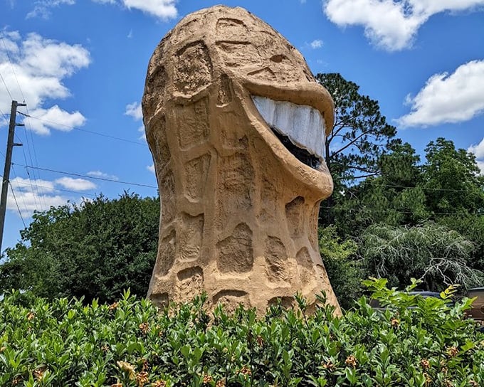 The monument catches perfect light, its cheerful expression unchanged after decades of watching Highway 45 traffic.