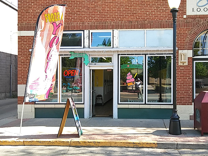 SoCo FroYo's cheerful storefront promises sweet relief from Colorado's sunshine. That ice cream cone in the window isn't just a sign&mdash;it's a beacon of hope on a hot day.