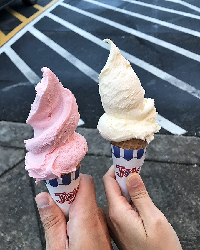 Vanilla and strawberry cones standing tall like frozen monuments to simplicity. Two scoops of happiness that make Monday feel like Saturday.