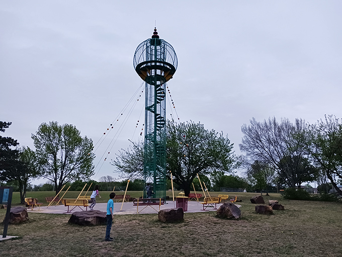 Sooner Park's Play Tower looks like something from The Jetsons, offering kids (and let's be honest, adults too) a whimsical climbing adventure.