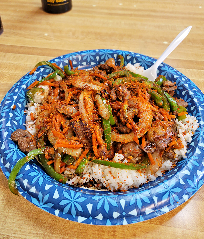 A colorful explosion of bulgogi over rice that would make your taste buds throw a party &ndash; spicy, sweet, and utterly unforgettable.