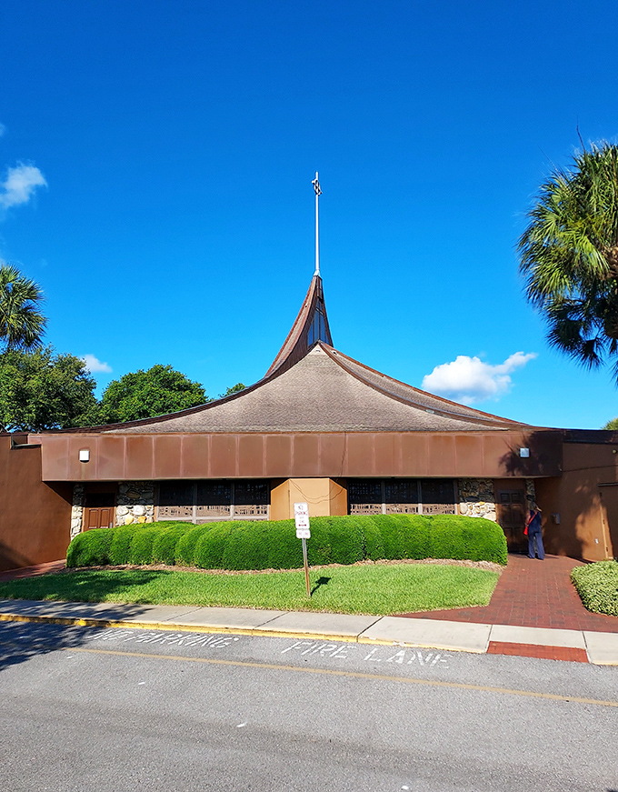 St. Ignatius Church's distinctive silhouette stands as a modern sanctuary amid palm trees &ndash; spiritual nourishment with a side of Florida sunshine.