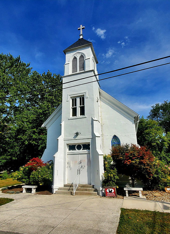 St. Michael's brilliant white facade pops against the blue sky, a postcard-perfect reminder of the island's enduring spiritual heritage.